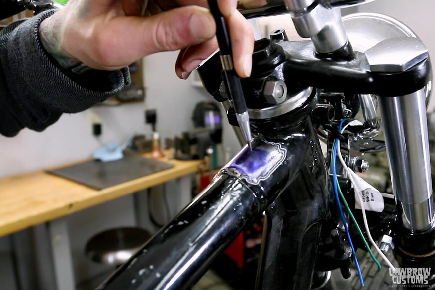 Using a center punch on your cross hairs to help with your pilot hole